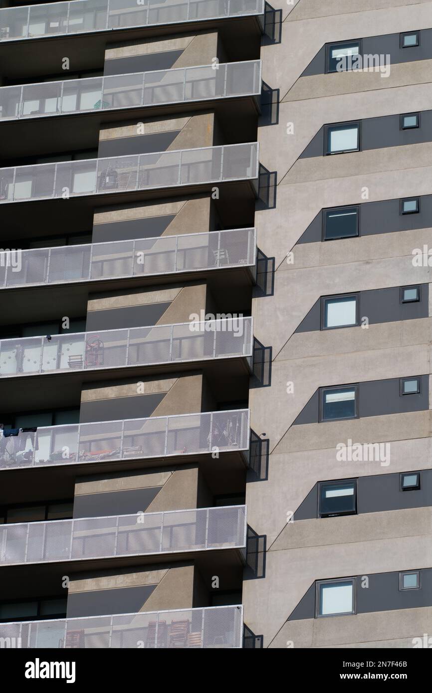 Apartment exterior view showing balconies, glass windows and ...