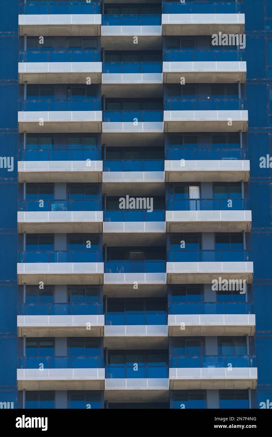 Apartment building exterior view showing balconies, glass windows and ...