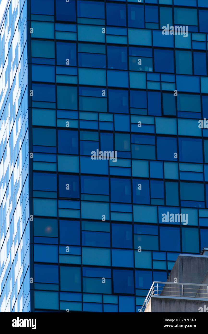 Modern city building apartment block with balconies, windows and glass ...