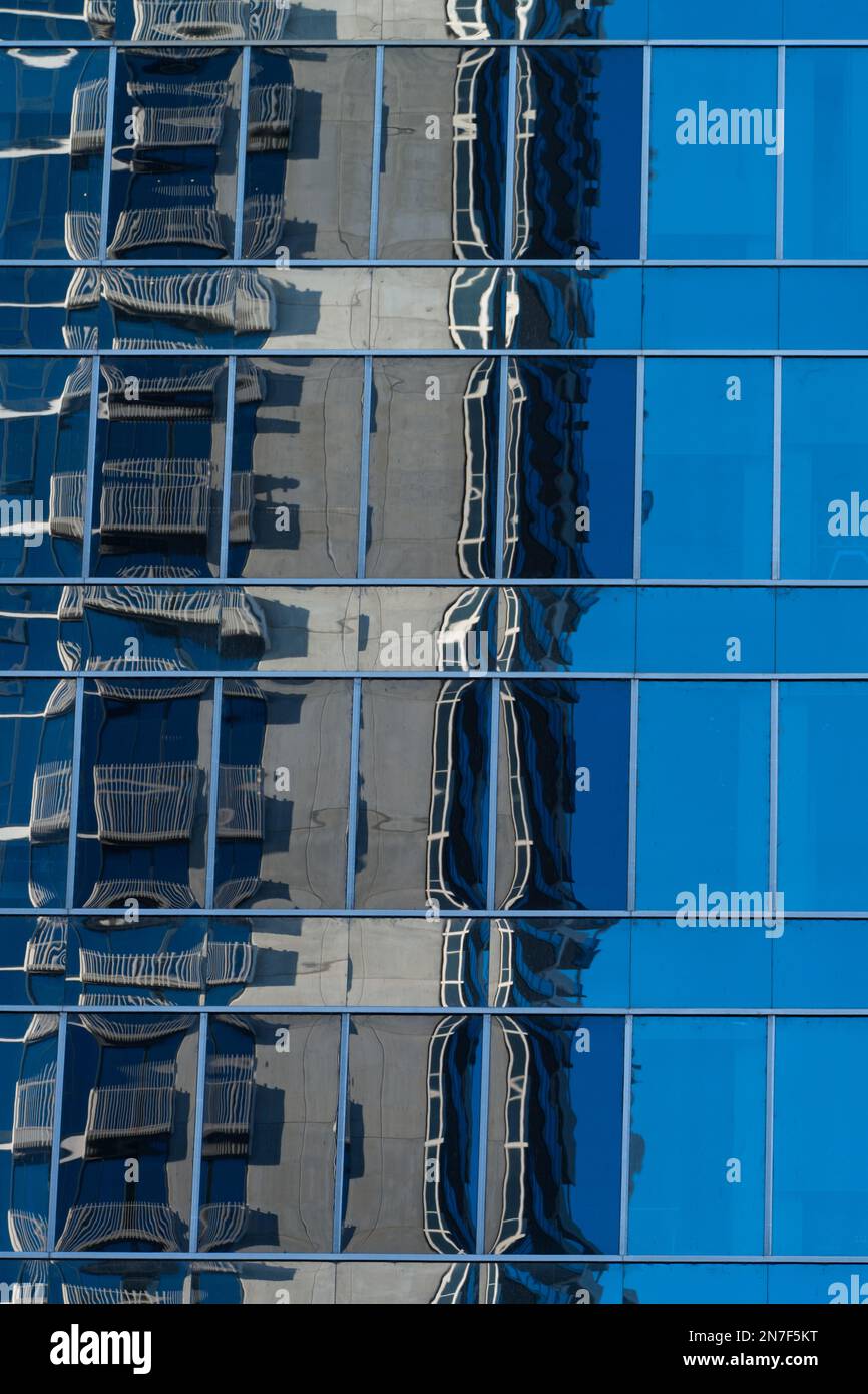 Modern city building apartment block with balconies, windows and glass ...