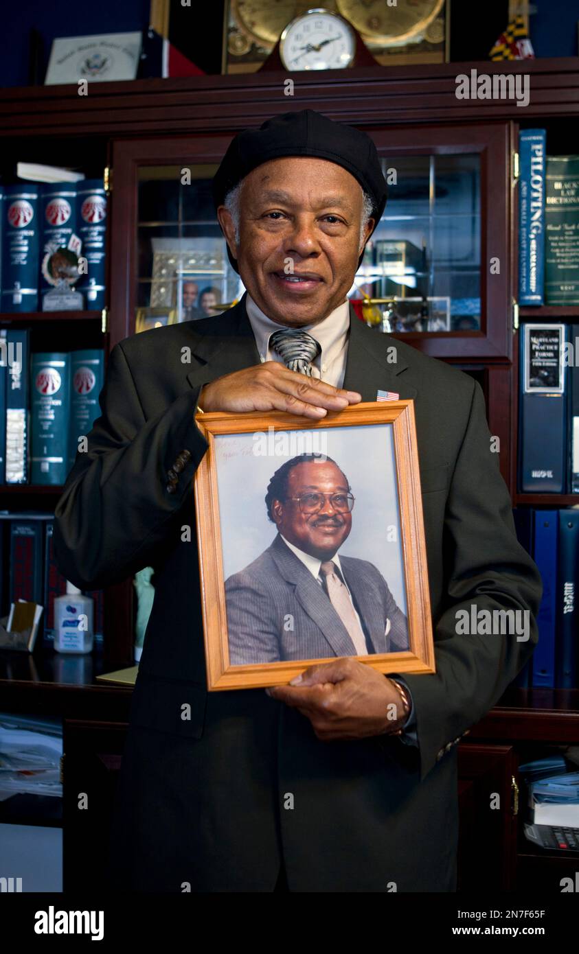 In this May 16, 2013, photo, Abdulah Salim, Jr. hold the photograph of ...