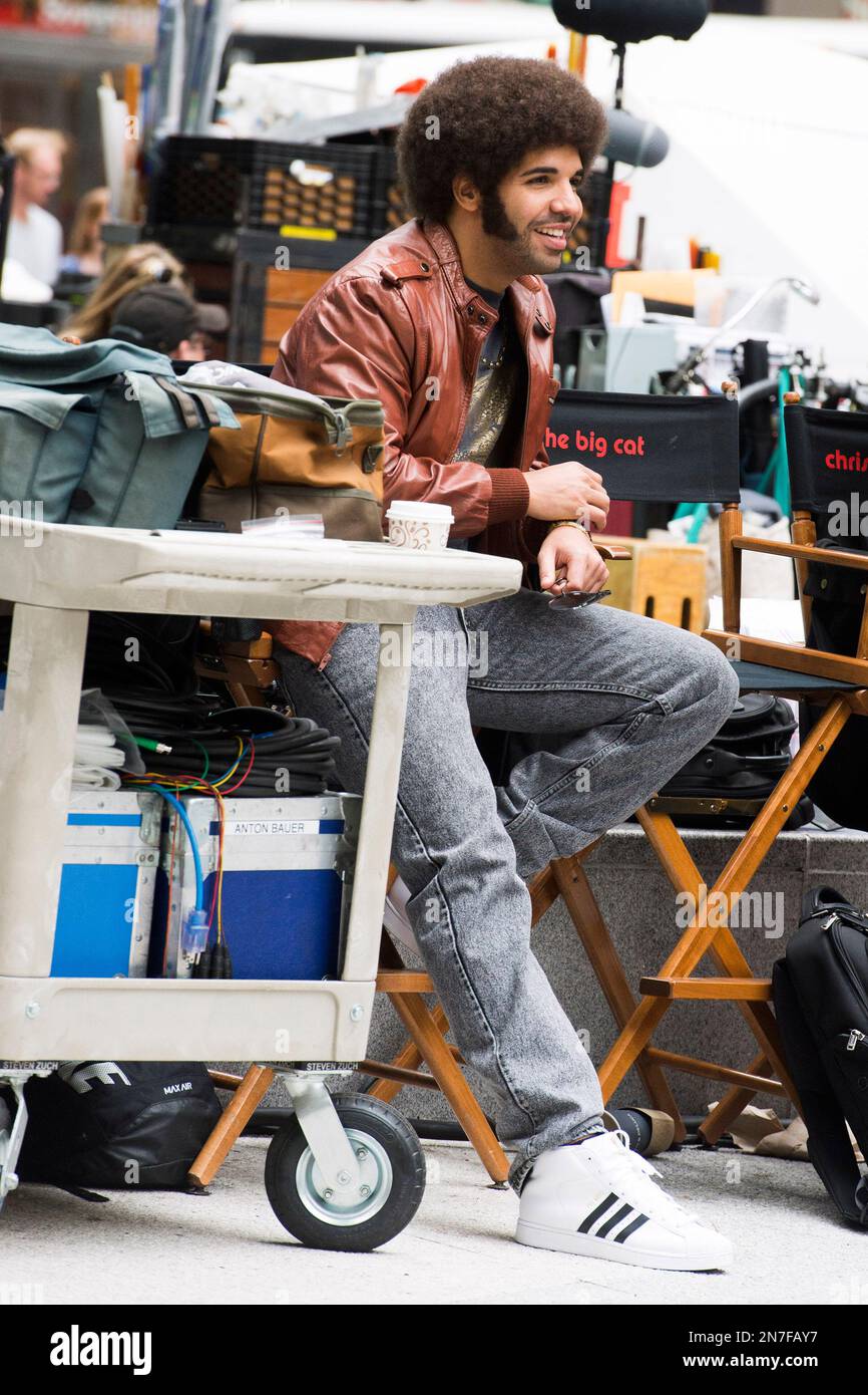 Drake takes a break between scenes while filming "Anchorman: The Legend ...