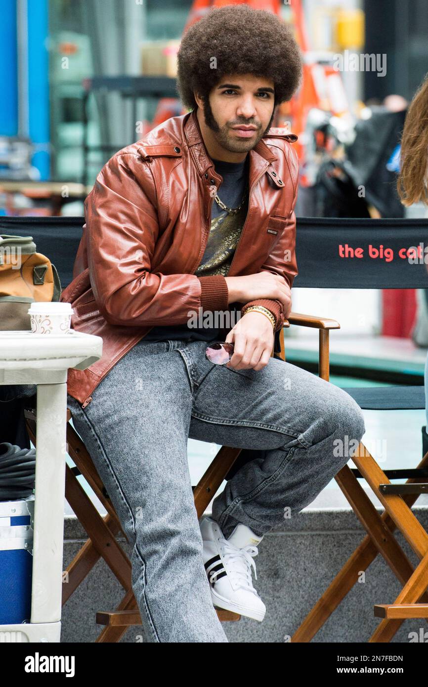 Drake takes a break between scenes while filming "Anchorman: The Legend ...