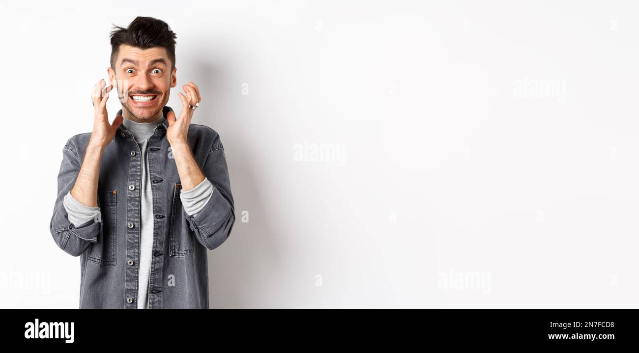 Angry man clench teeth and stare with hatred and anger at camera ...