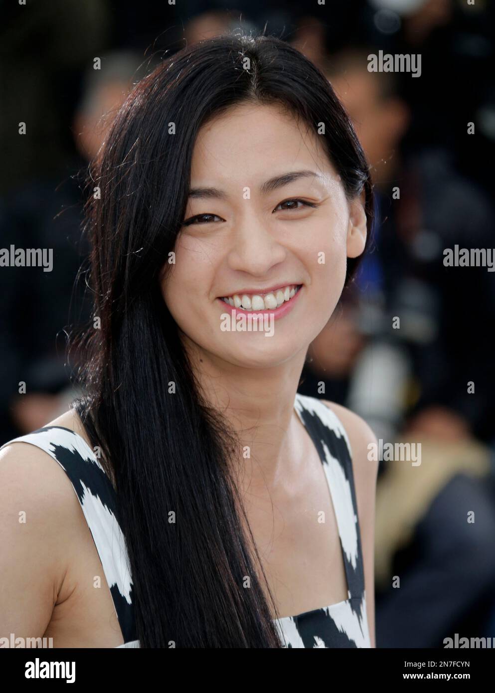 Actress Machiko Ono poses during a photo call for the film Like Father ...