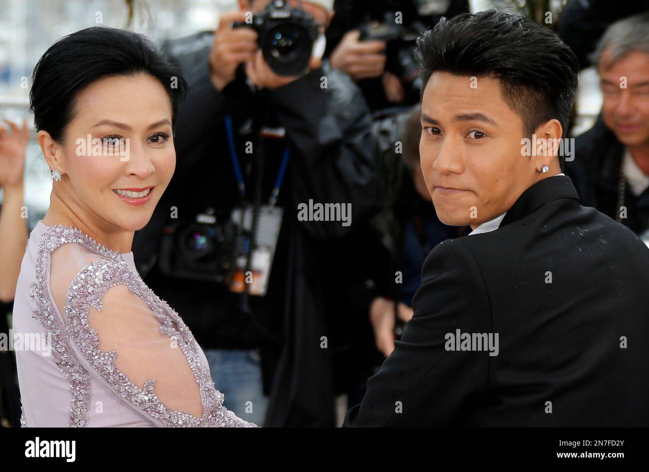 Actor Carina Lau, left, and actor Kun Chen pose for photographers during a photo call for the ...