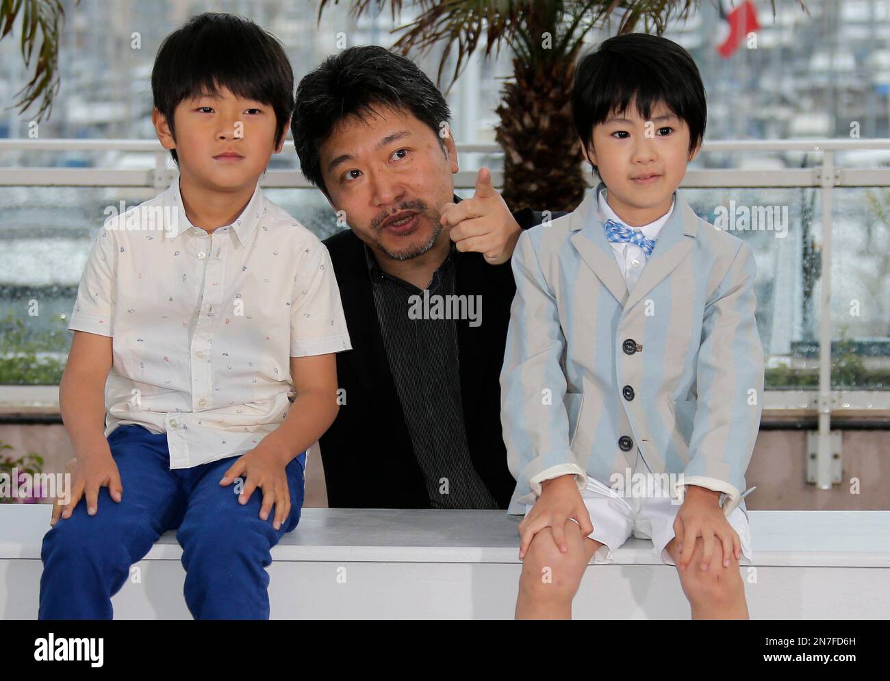 From left, actor Shogen Whang, director Hirokazu Kore-eda, centre, and ...