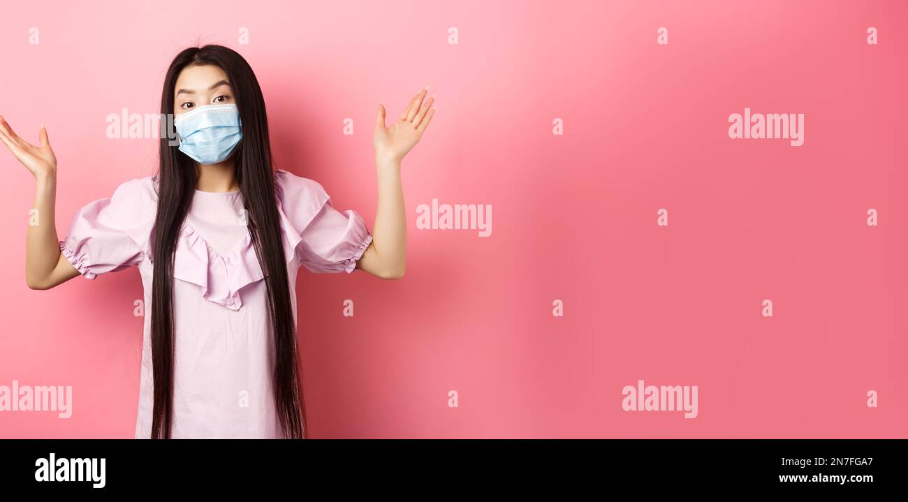 Coronavirus, quarantine and lifestyle concept. Clueless asian girl in ...