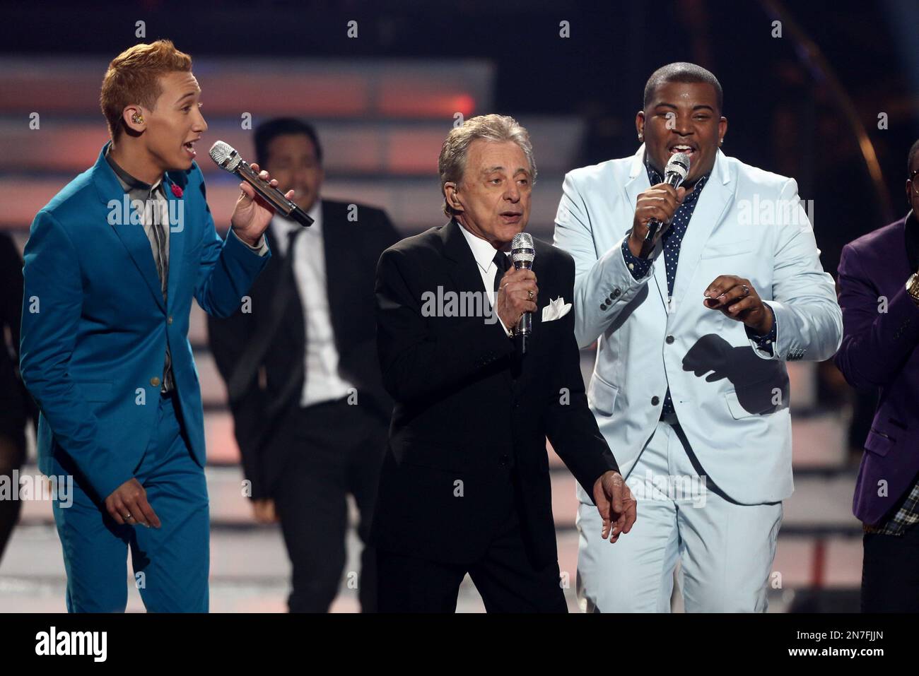 Frankie Valli, center, and from left, contestants Devin Velez and ...