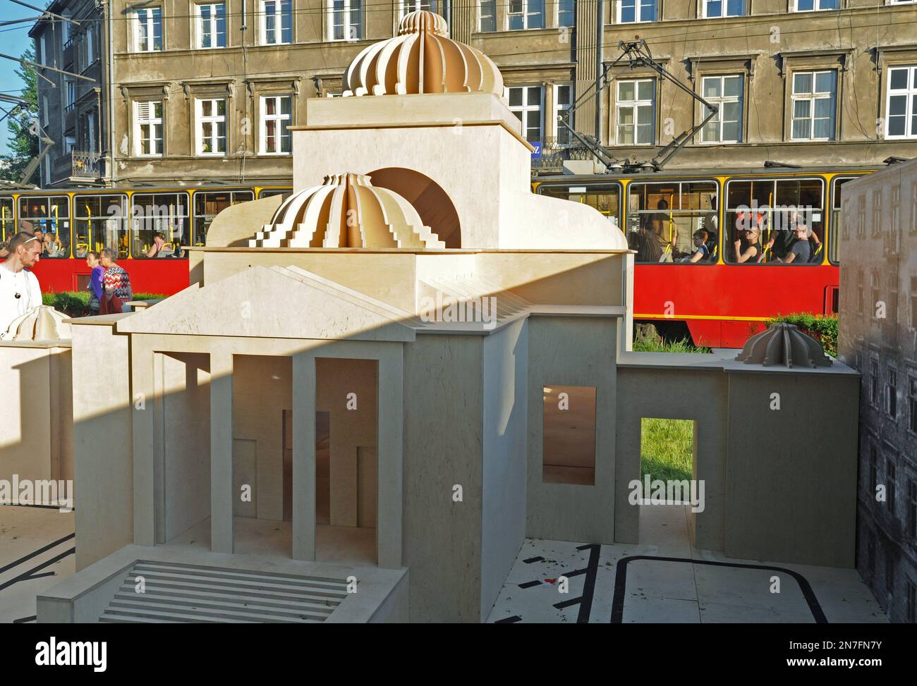 People look at a 1:10 scale model of the Great Synagogue of Warsaw and ...