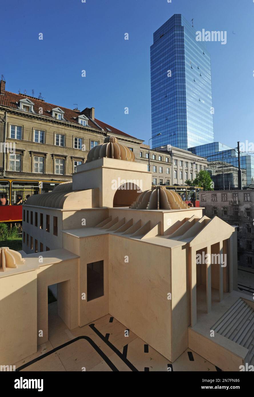 A streetcar drives past a 1:10 scale model of the Great Synagogue of ...