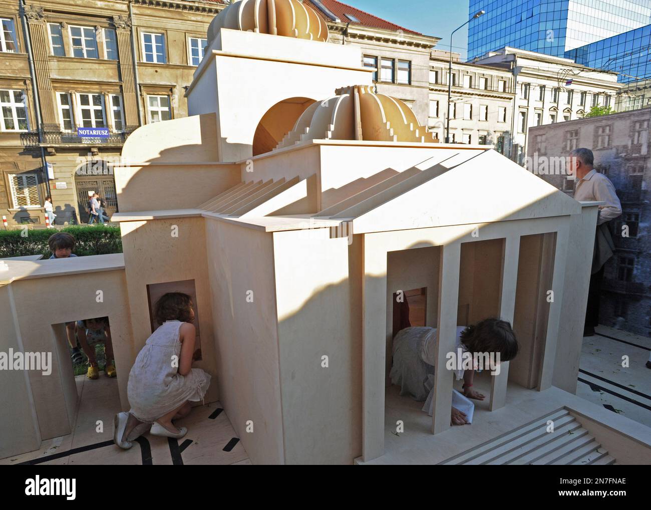 Children play in a 1:10 scale model of the Great Synagogue of Warsaw ...