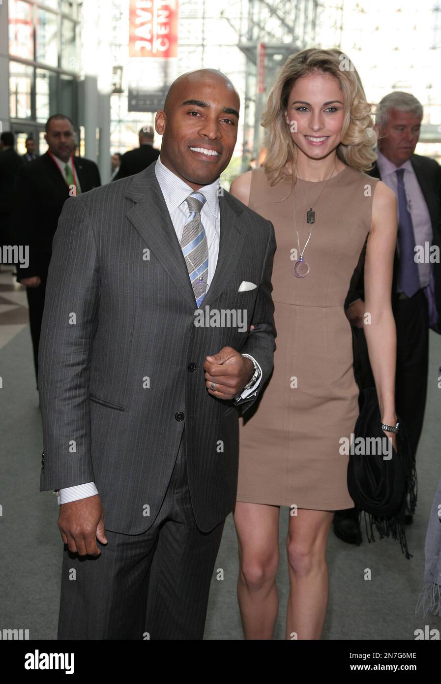 Retired football player Tiki Barber, left, and his wife Traci Lynn ...