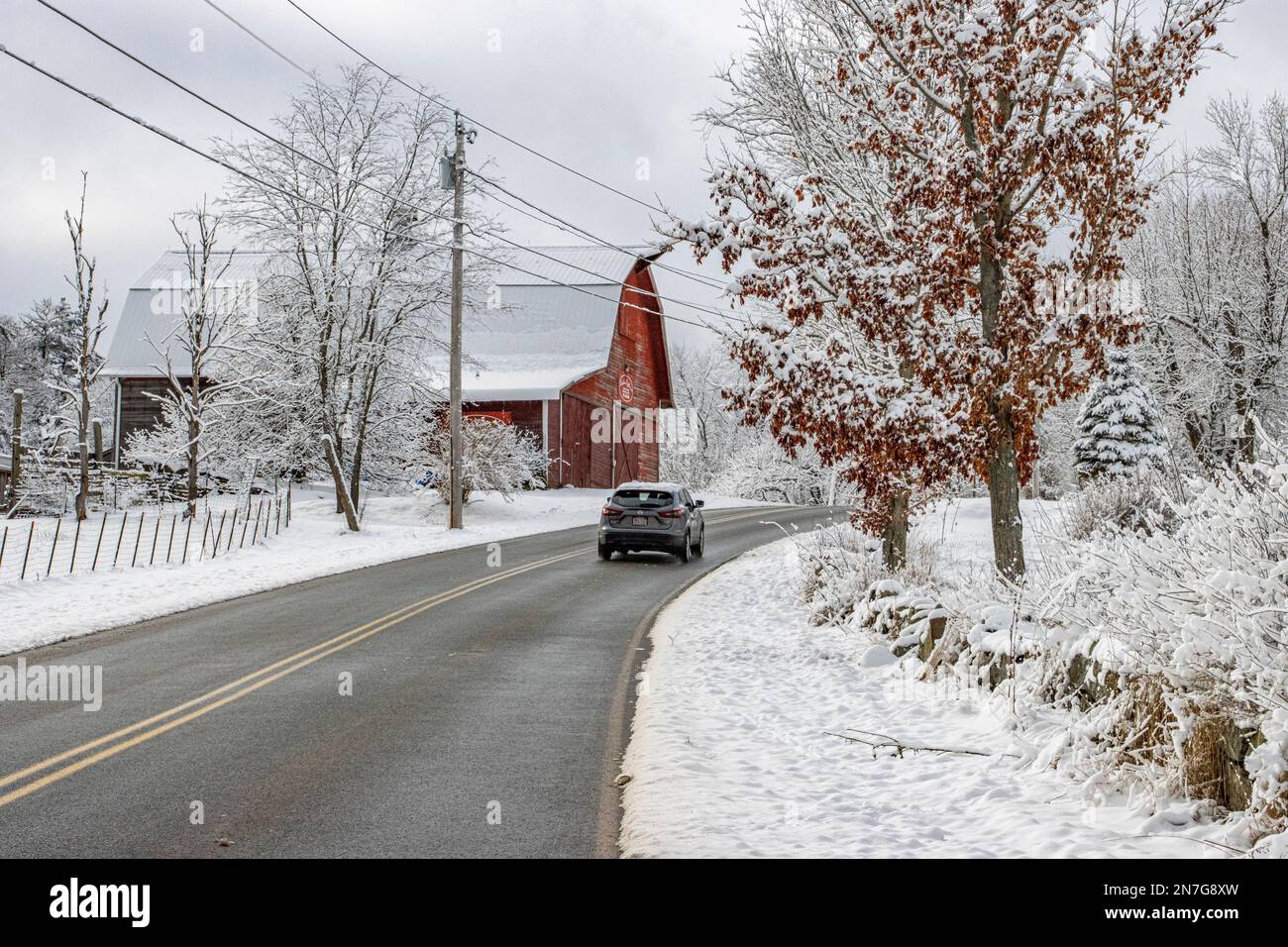 An old red barn covered in snow in Royalston, Massachusetts Stock Photo ...