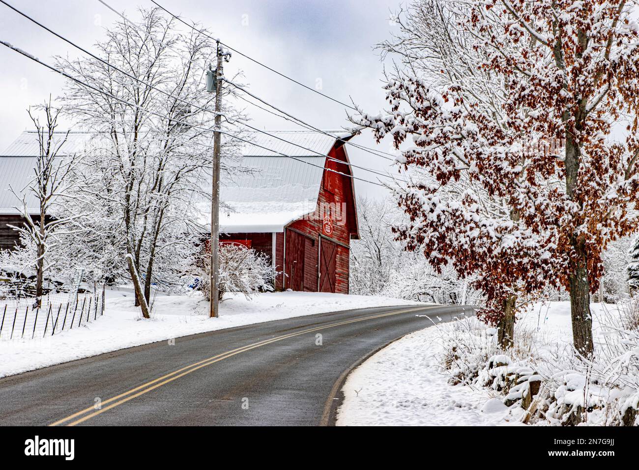 An old red barn covered in snow in Royalston, Massachusetts Stock Photo ...