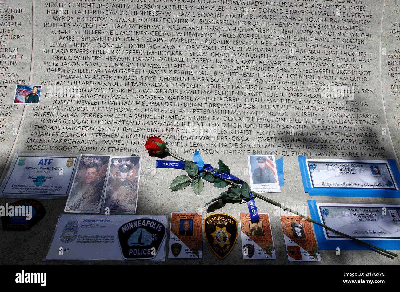 A rose is placed at the wall with the names of fallen police officers ...