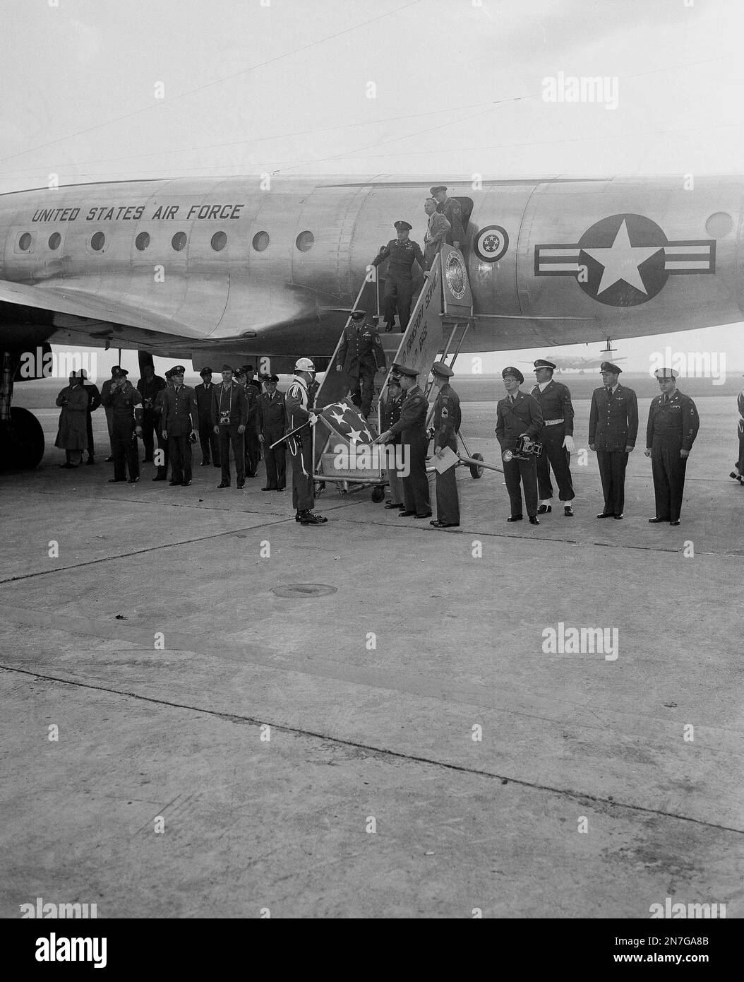 Gen. Douglas MacArthur's five-star flag is brought to his plane Bataan ...