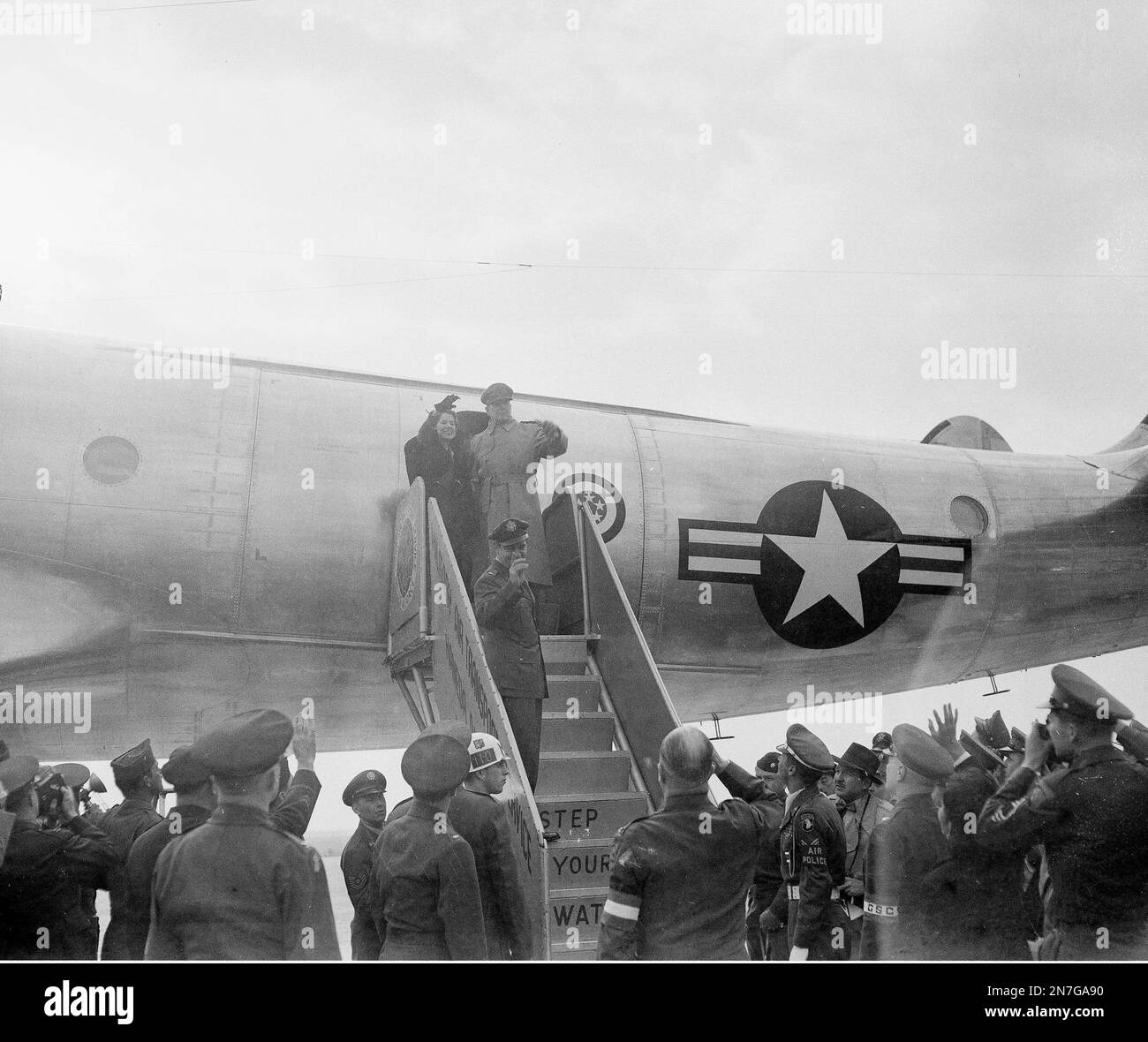 Gen. Douglas MacArthur and his wife Jean stand in the door of the ...