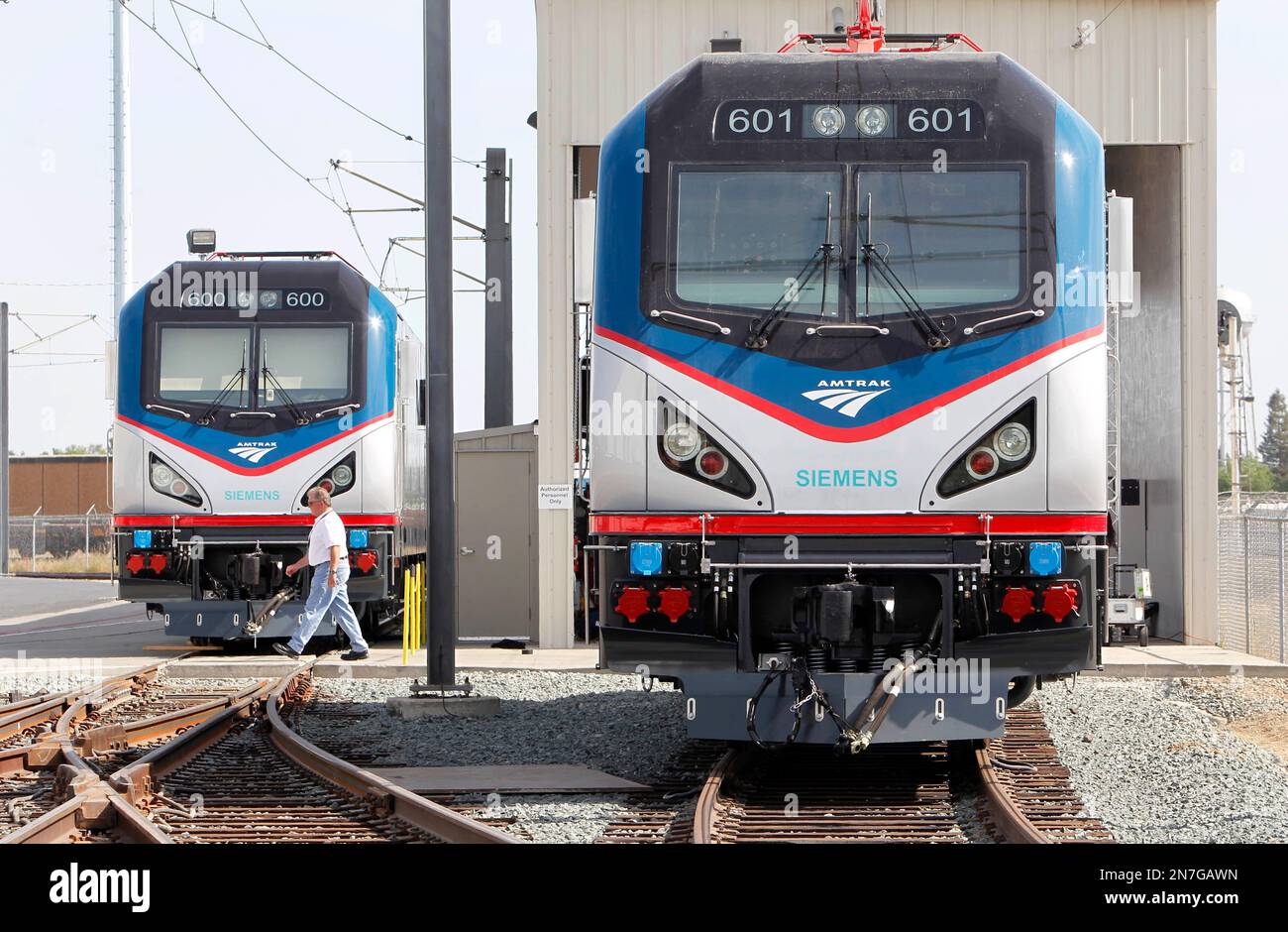 In this photo taken Saturday, May 11, 2013, are two of the new Amtrak ...