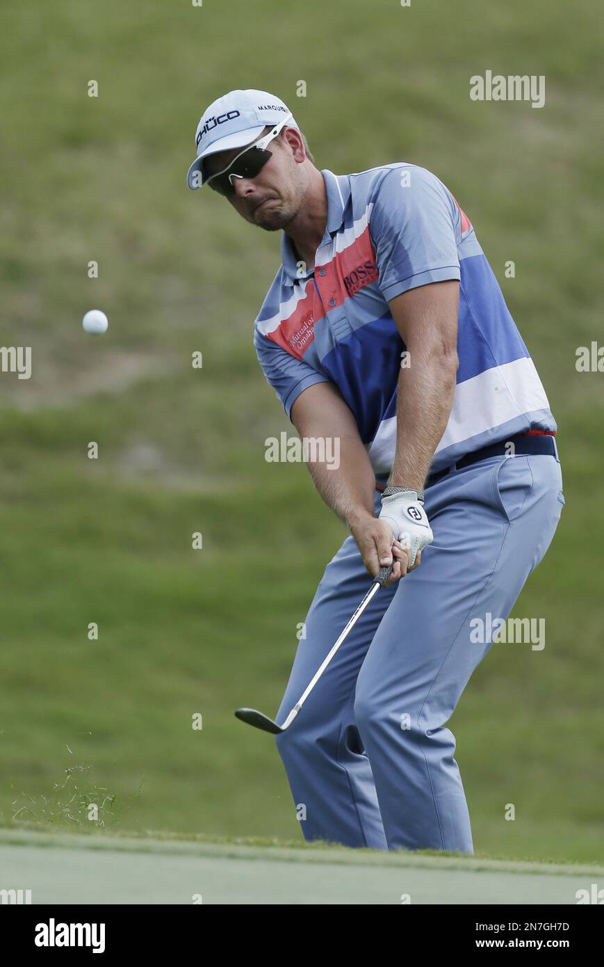 Henrik Stenson, of Sweden, chips onto the seventh green during the ...