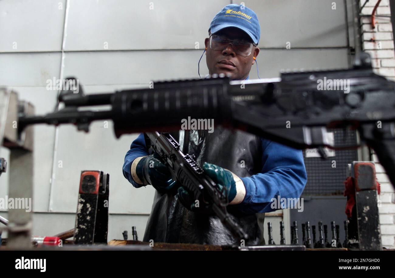 A worker assembles a Galil-GT assault rifle at the Colombian based ...