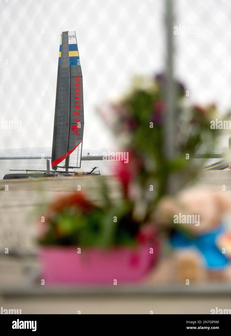 Flowers and a teddy bear form a memorial to British sailor Andrew "Bart ...