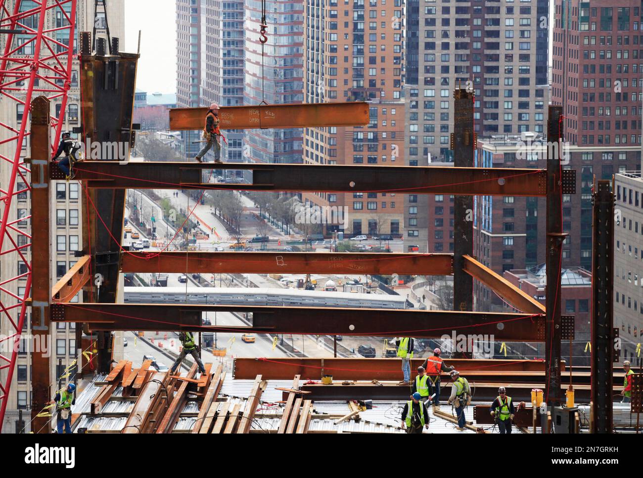 FILE - In this March 25, 2010 file photo, an ironworker walks on a beam ...