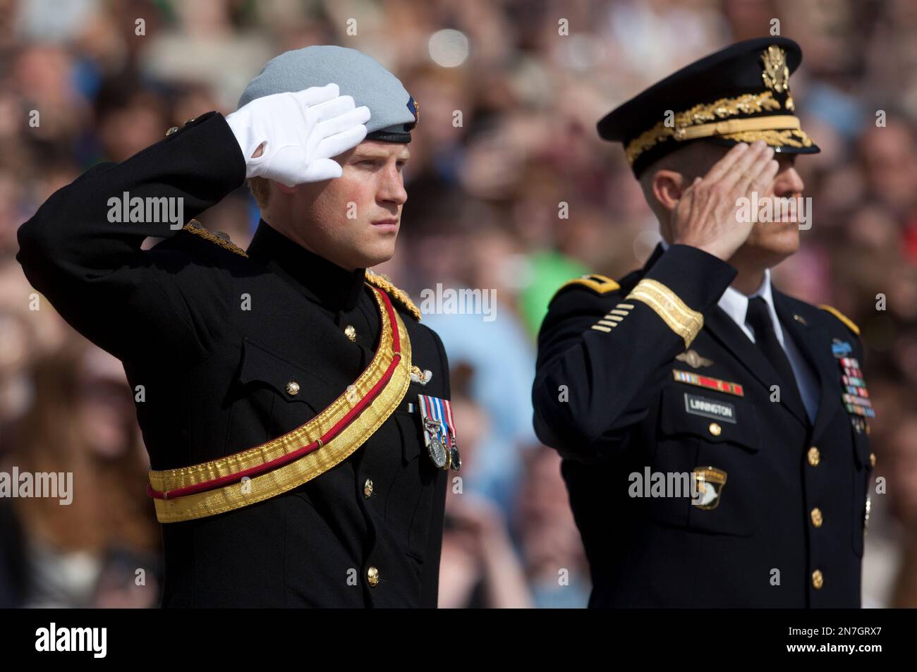 Prince Harry and Major General Michael Linnington, right, salute during ...