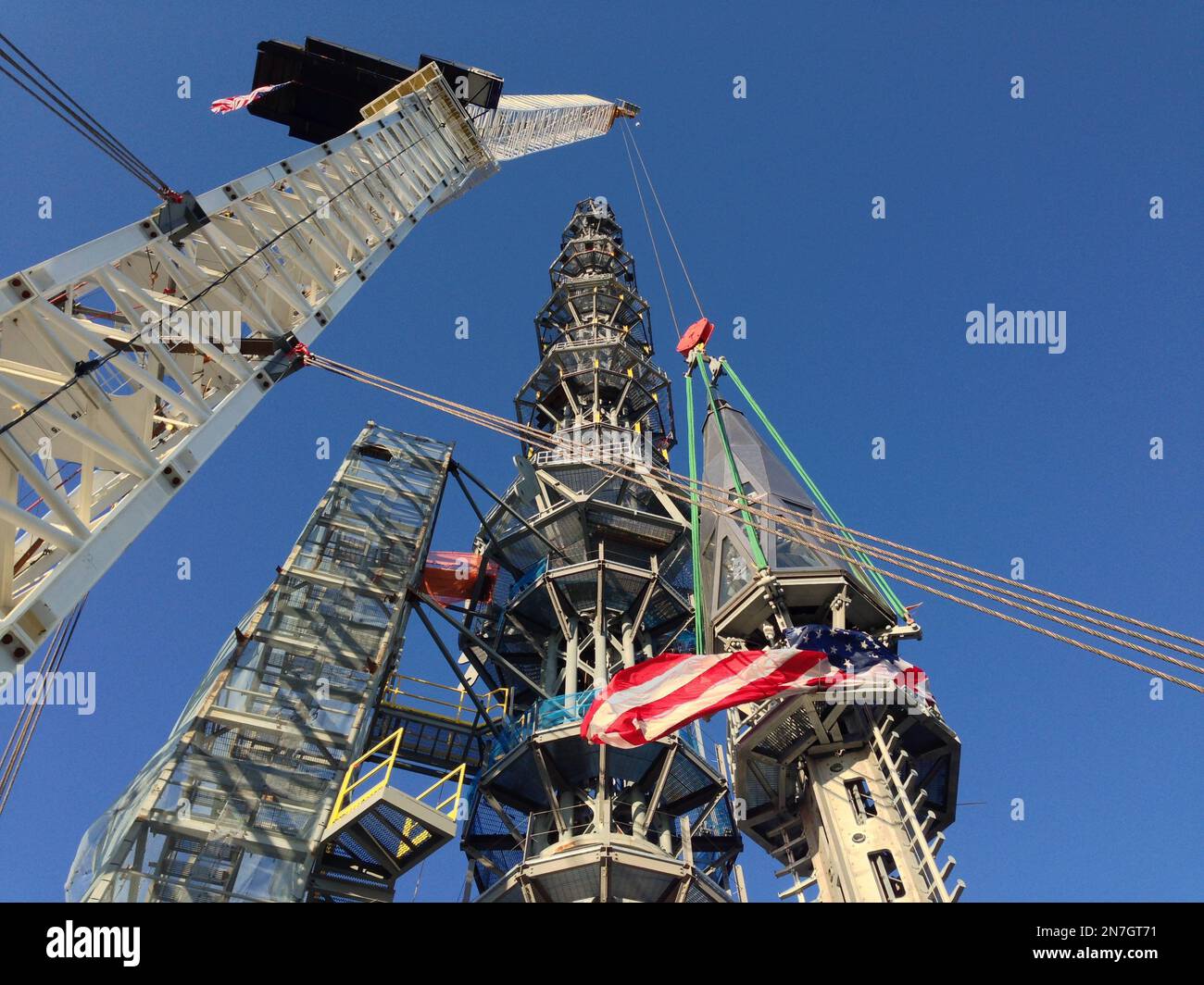 The silver spire topping One World Trade Center is fully installed on ...