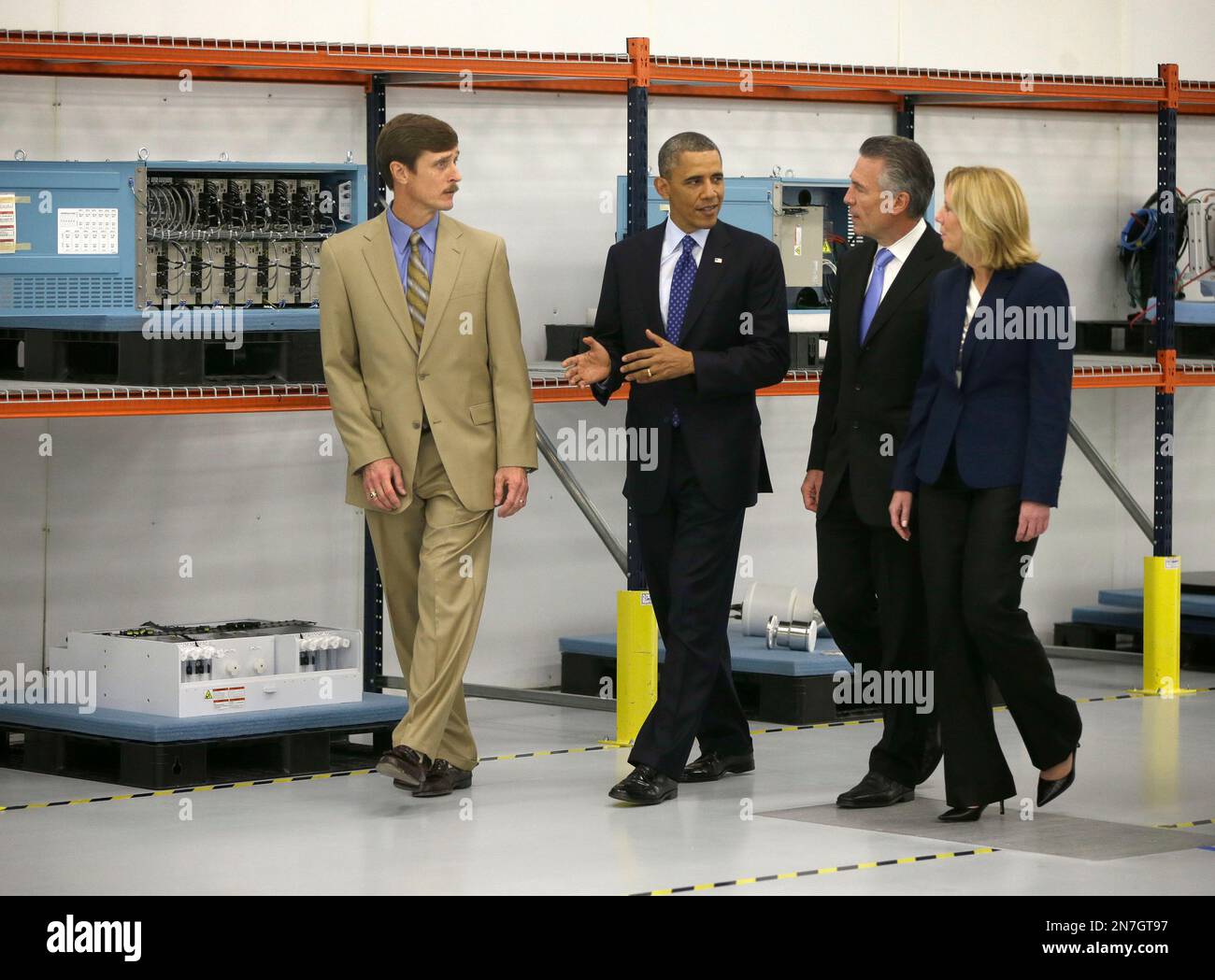 President Barack Obama, center, tours Applied Materials Inc., with from ...