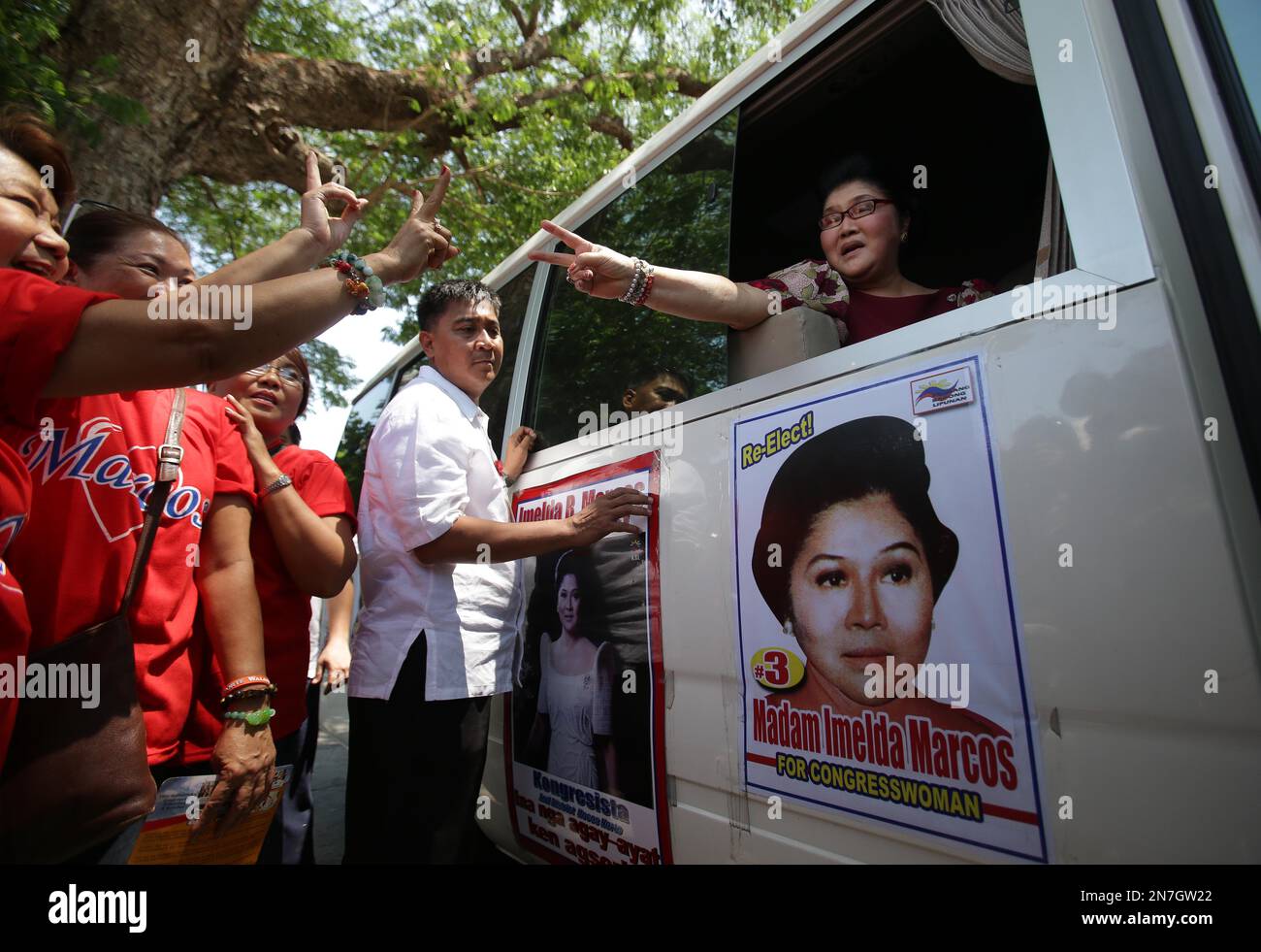 In this May 5, 2013 photo, former Philippine First Lady Imelda Marcos, right, gestures towards ...