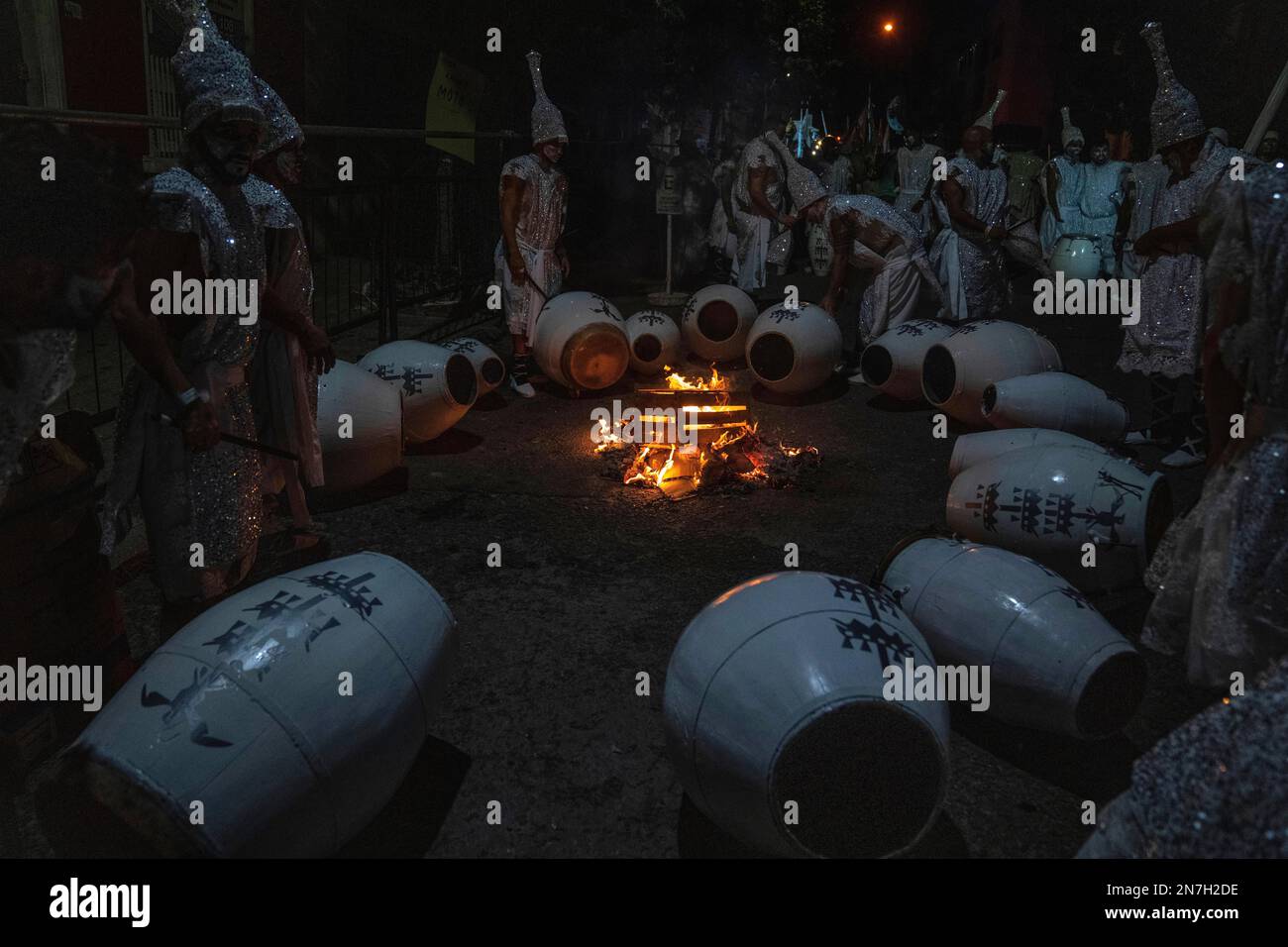 Candombe drummers tune their drums with fire in preparation for "Las ...