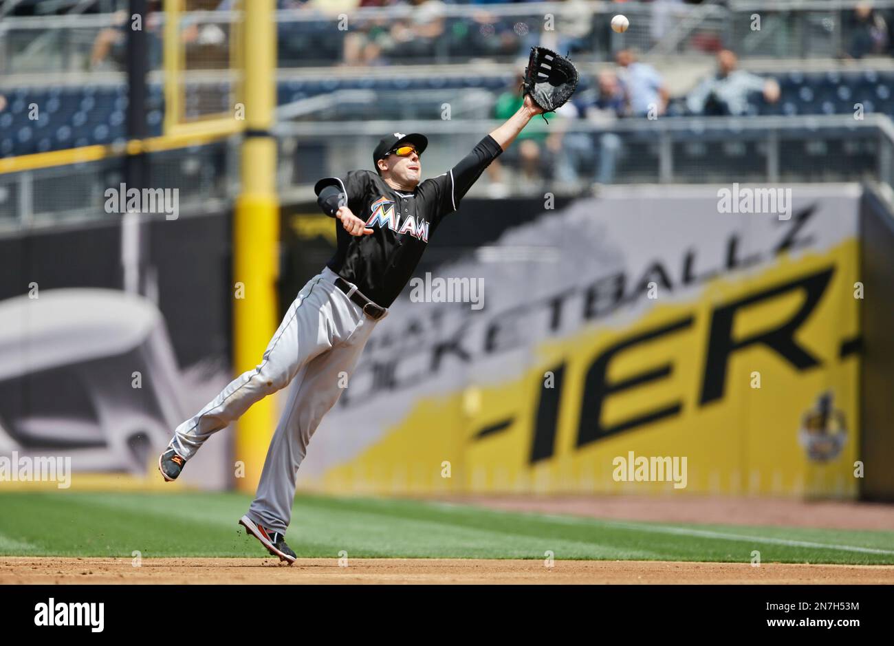 Miami Marlins first baseman Greg Dobbs can't reach a double down the ...