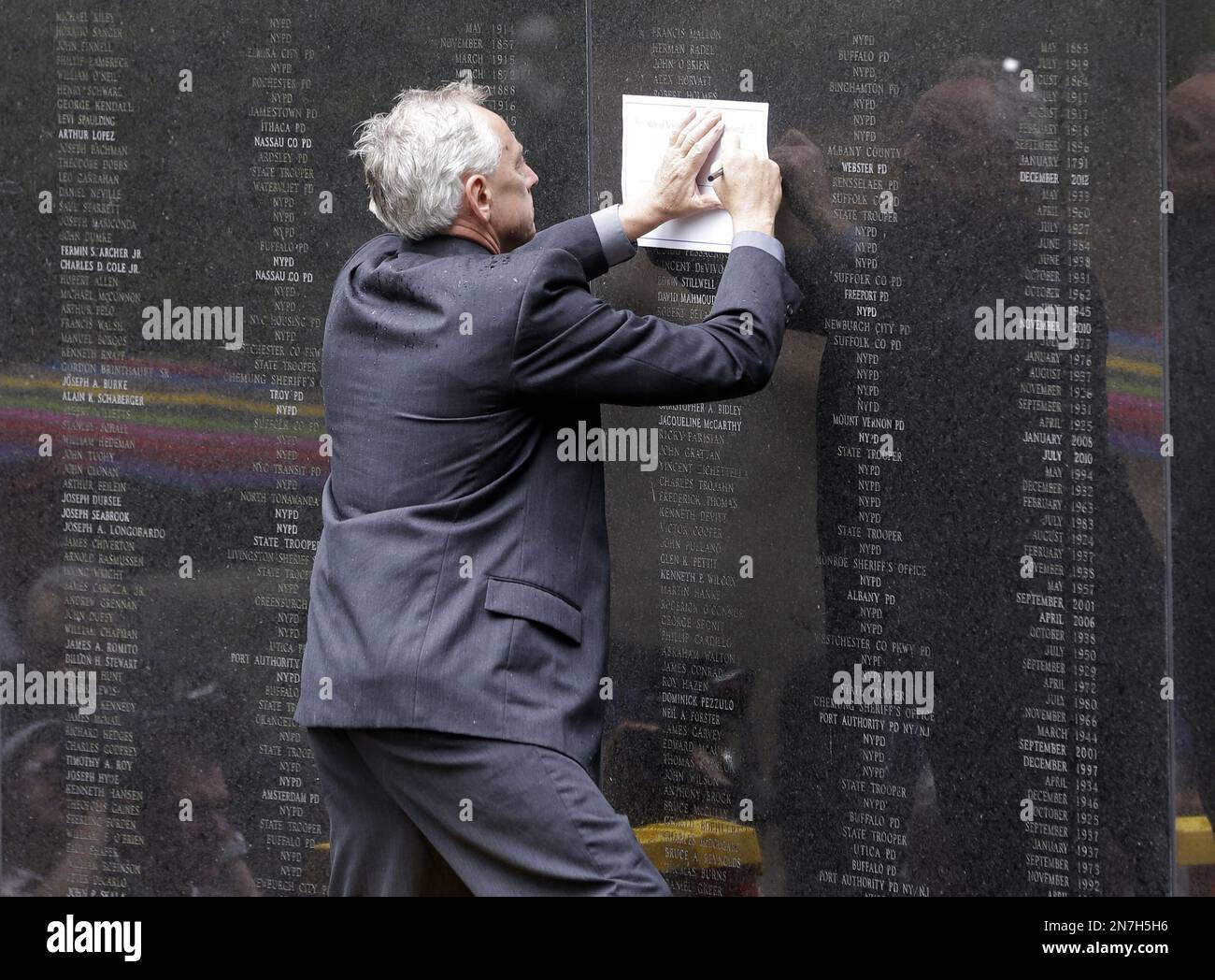 Thomas Canning of the Department of Criminal Justice Services etches ...