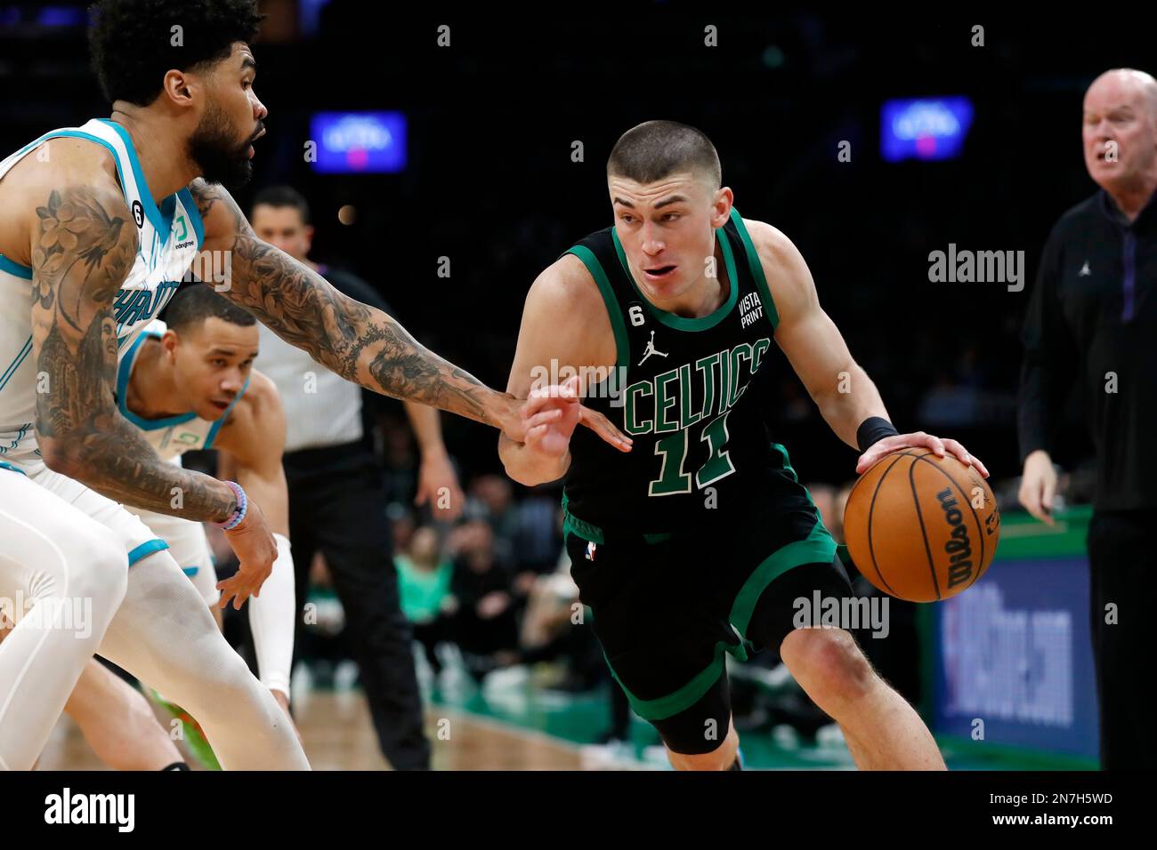 Boston Celtics' Payton Pritchard (11) drives past Charlotte Hornets ...
