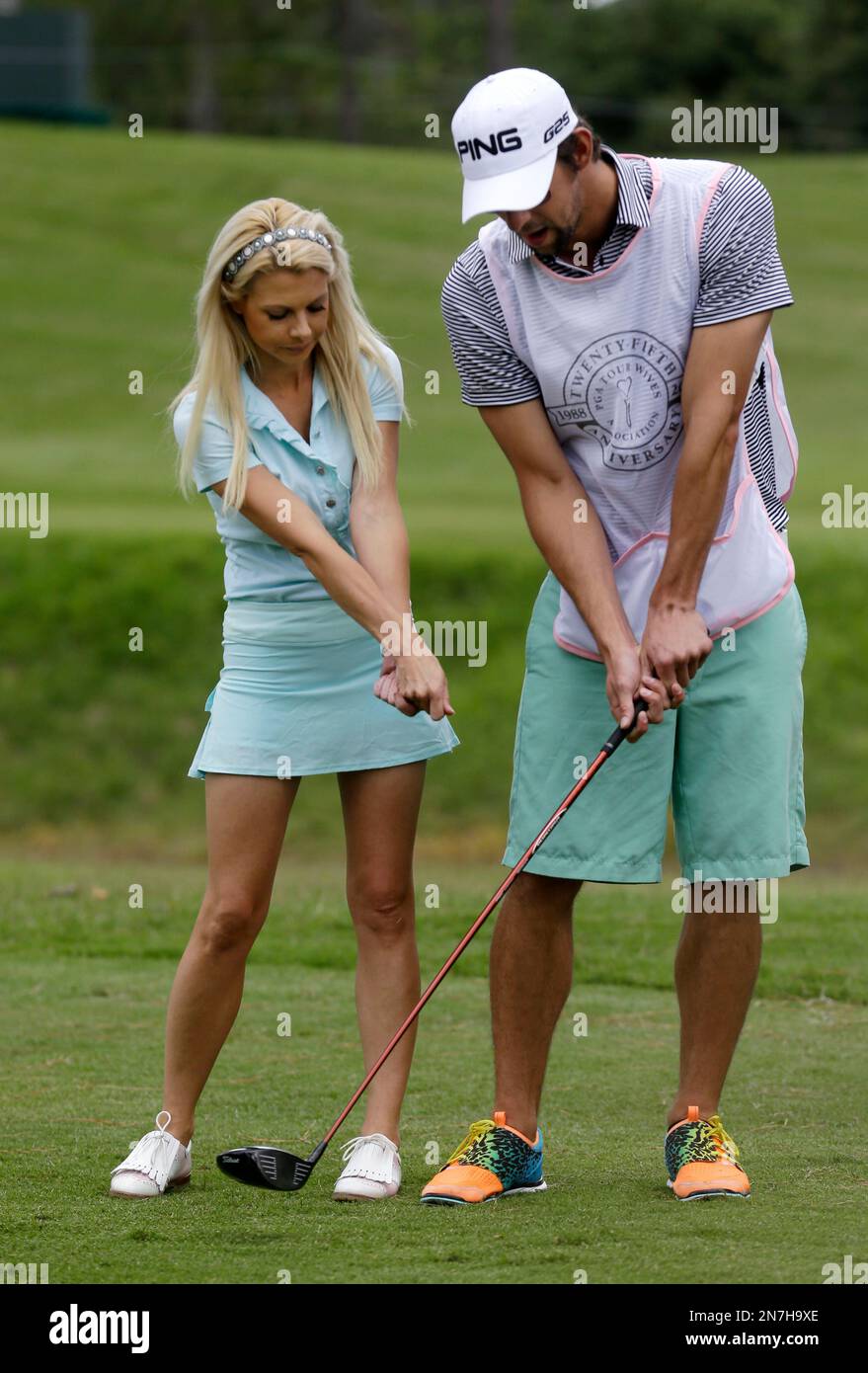 Win McMurry, left, of the Golf Channel, coaches the swing of Olympic ...
