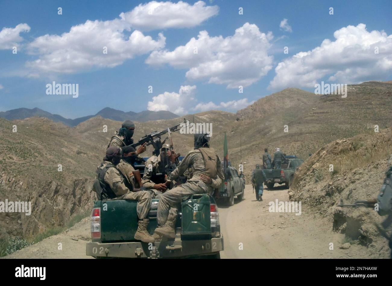 Afghan border policemen patrol on the border between Afghanistan and ...