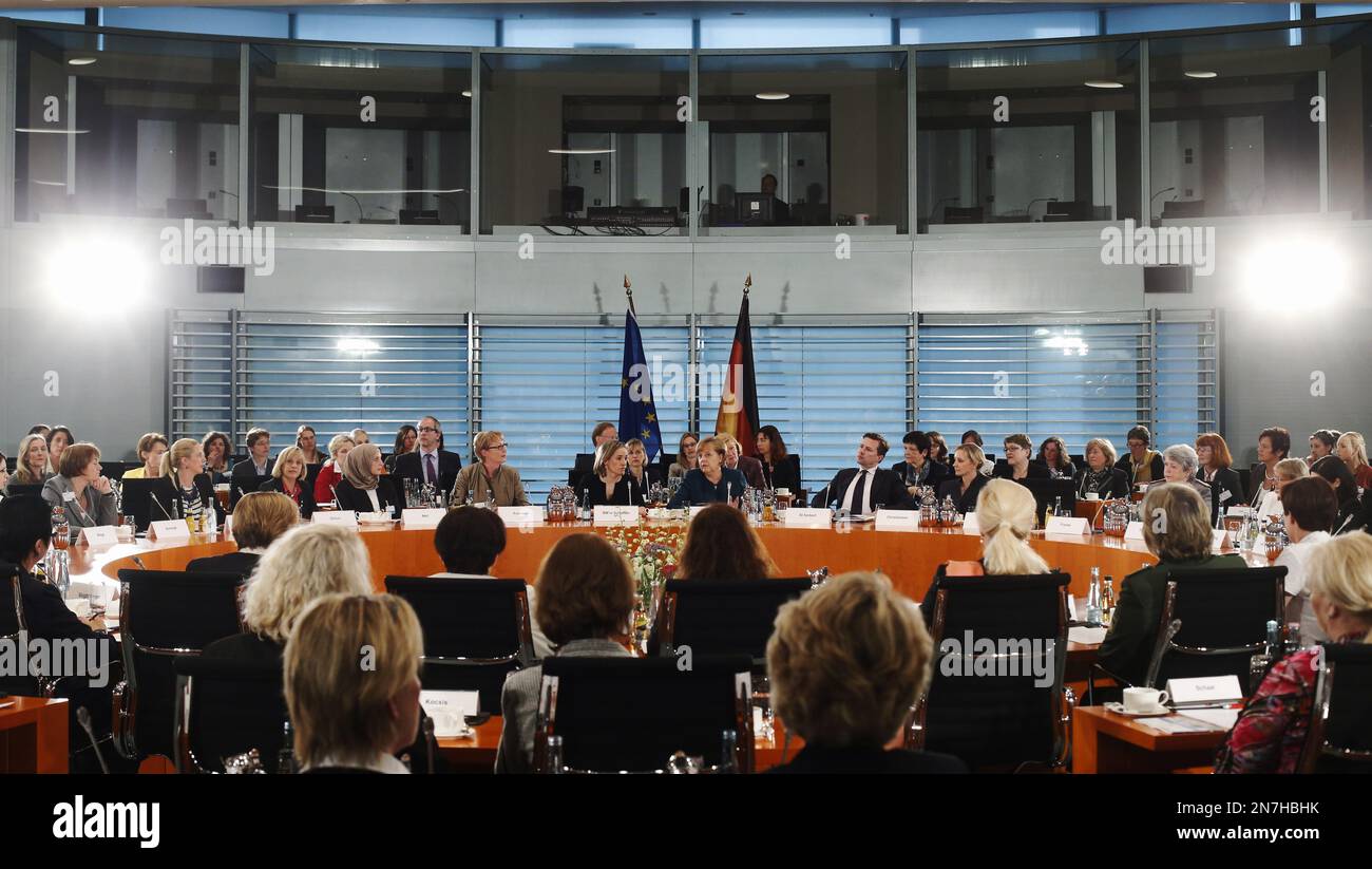 German Chancellor Angela Merkel, center, delivers her opening speech at ...