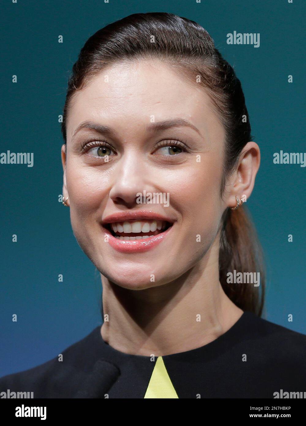 Actress Olga Kurylenko smiles during a press conference to promote her ...