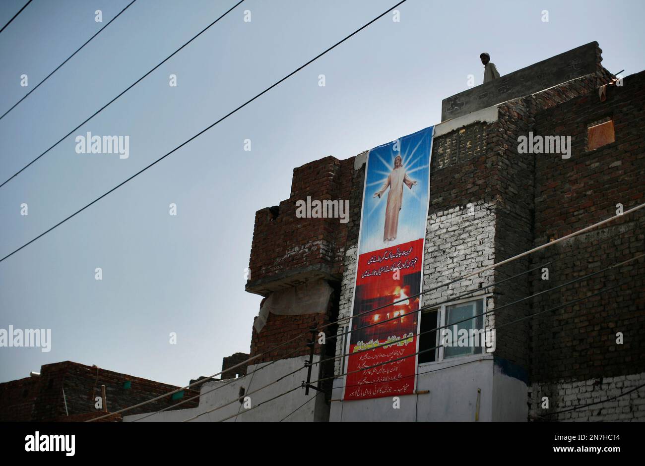 This Tuesday, April 30, 2013 photo shows a Pakistani Christian peering ...