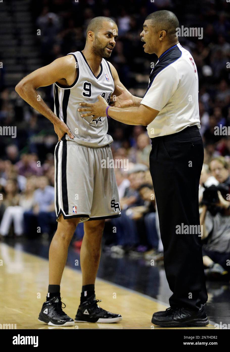 San Antonio Spurs' Tony Parker (9) of France, talks with official Tony ...