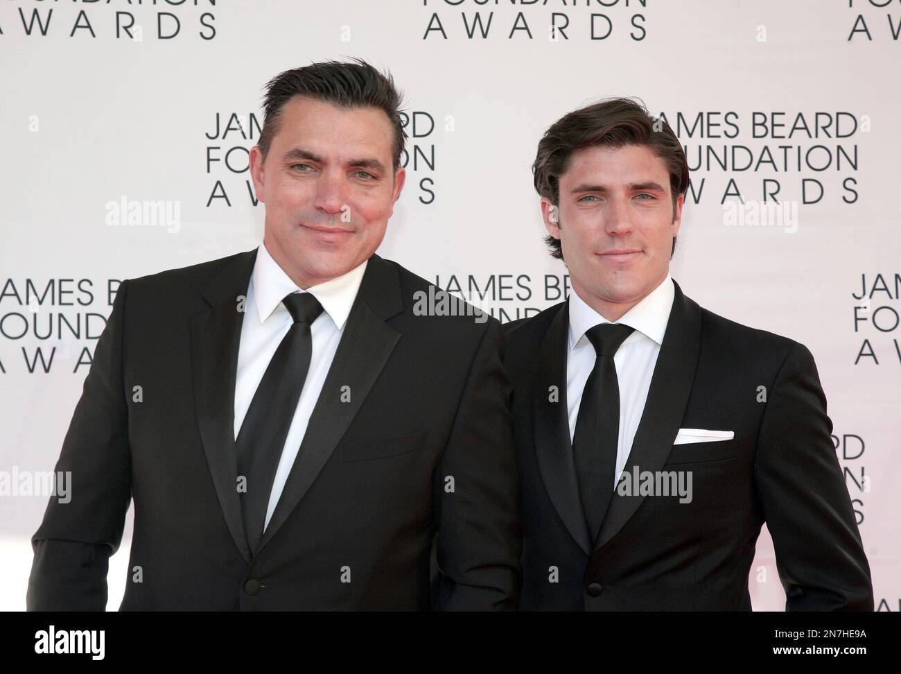 Restauranteur Todd English, left, with his son Oliver English, arrives ...