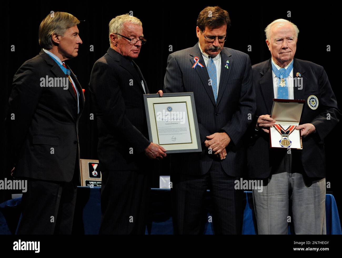 William Sherlach, second from right, accepts the citizen honor of the ...