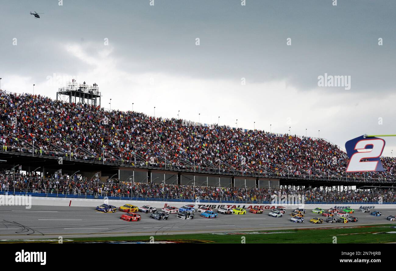 NASCAR Sprint Cup Series drivers race through the tri-oval under ...