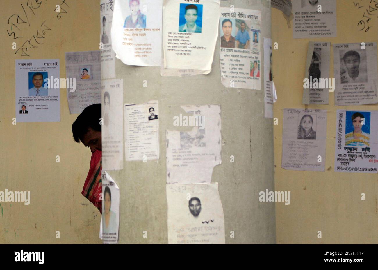 A man covers his nose to block out the smell of bodies at the morgue ...