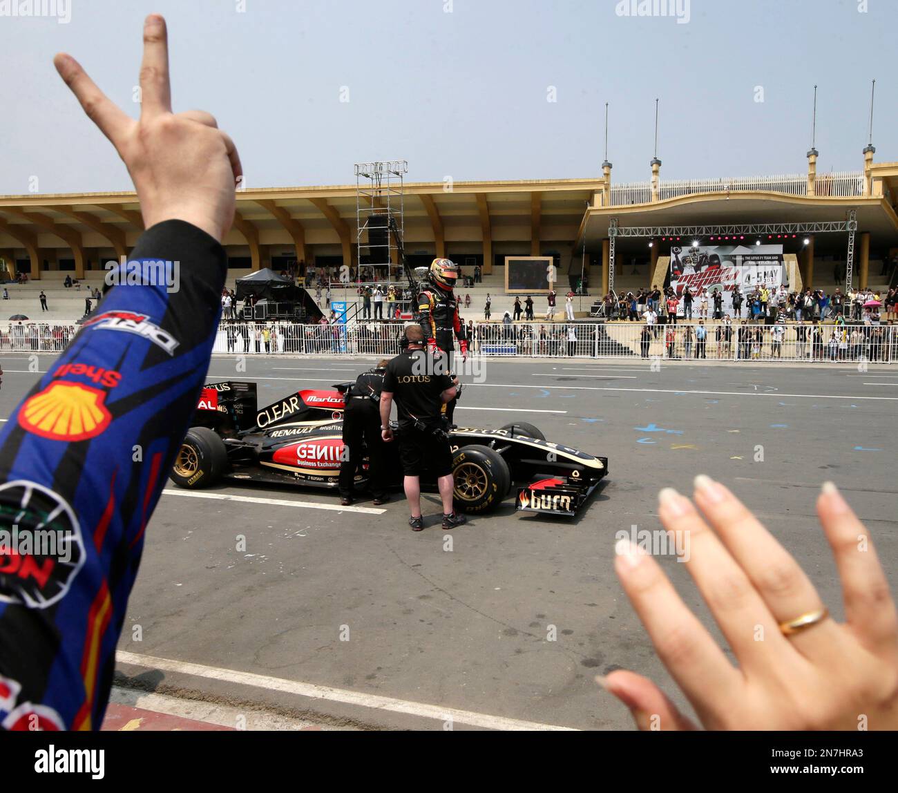 Fans cheer at Lotus Formula One junior driver Marlon Stockinger after a ...