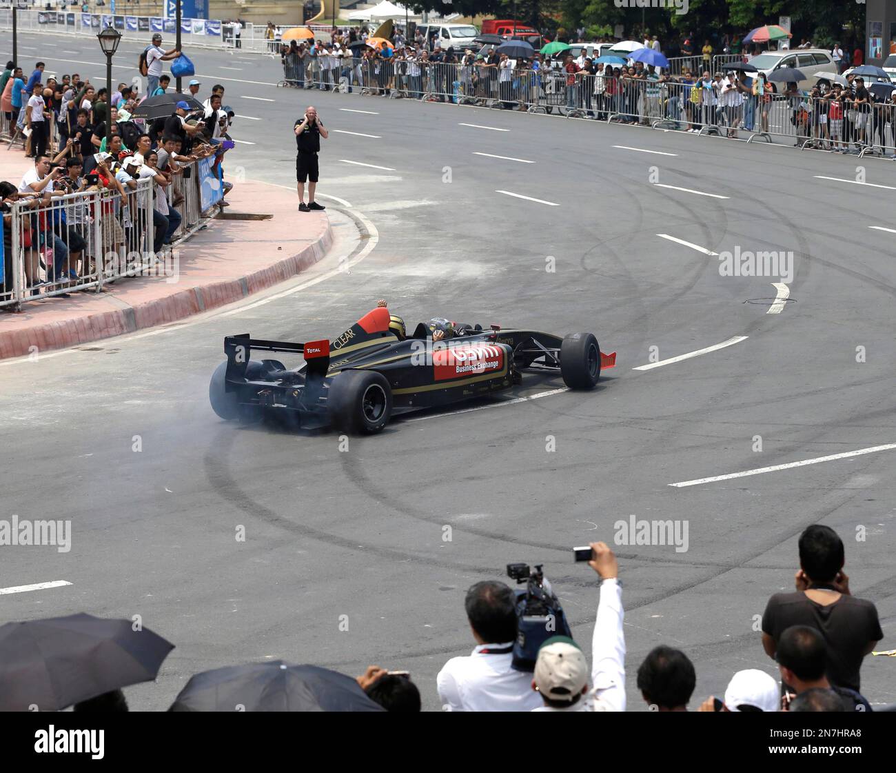 A Lotus Formula One test driver steers his race car during a ...