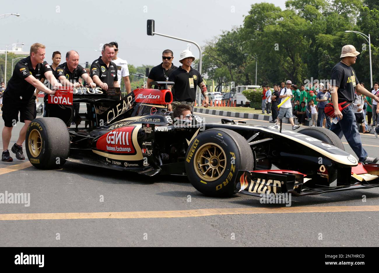 Lotus Formula 1 crew push their race car for the ceremony at Kilometer ...
