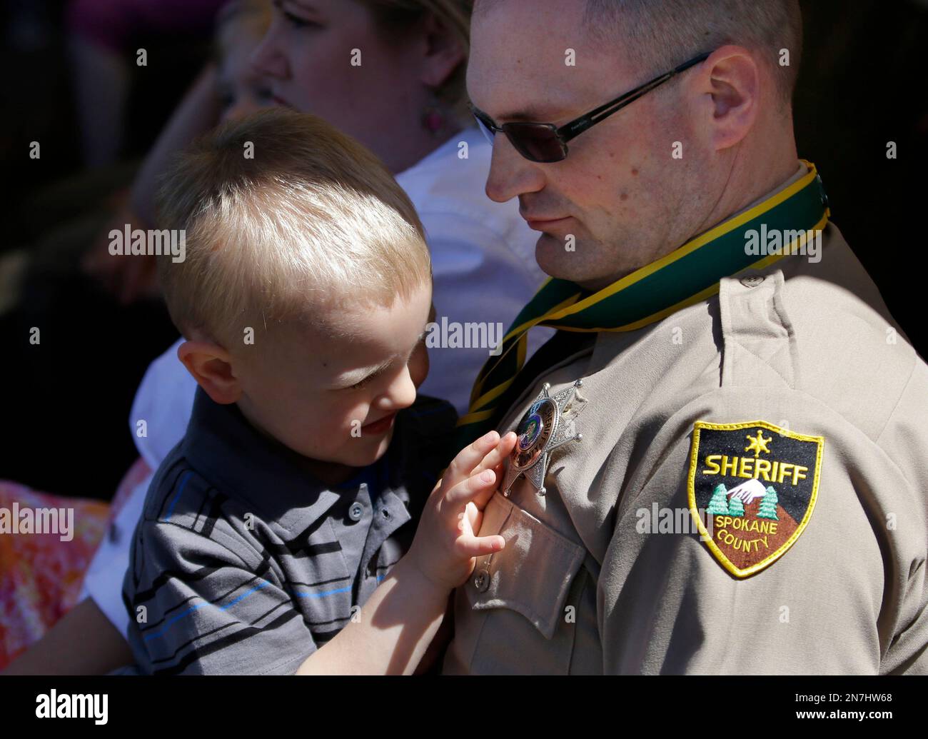 Spokane County Sheriff's Deputy Michael Northway sits with his son ...