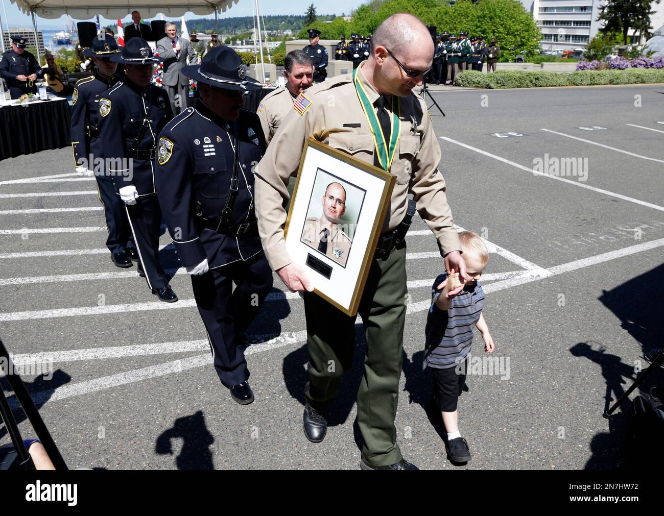 Spokane County Sheriff's Deputy Michael Northway walks with his son ...